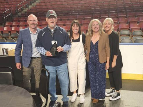 AAU’s Former Director of Sports Awarded the Community Impact Award | AAU